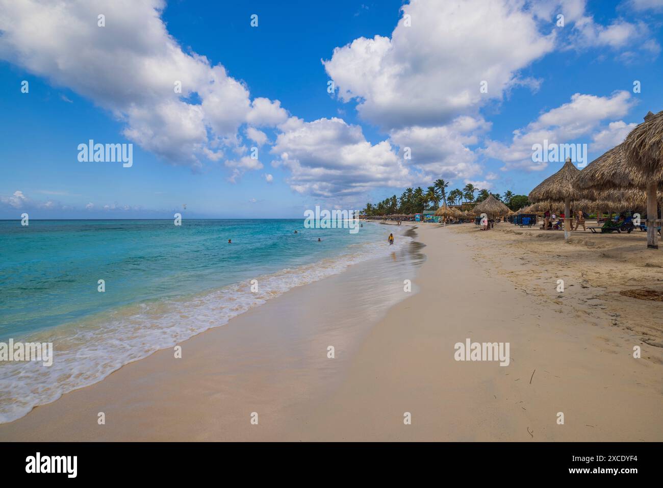 Gorgeous scene of the Caribbean Sea's azure waters with people enjoying ...