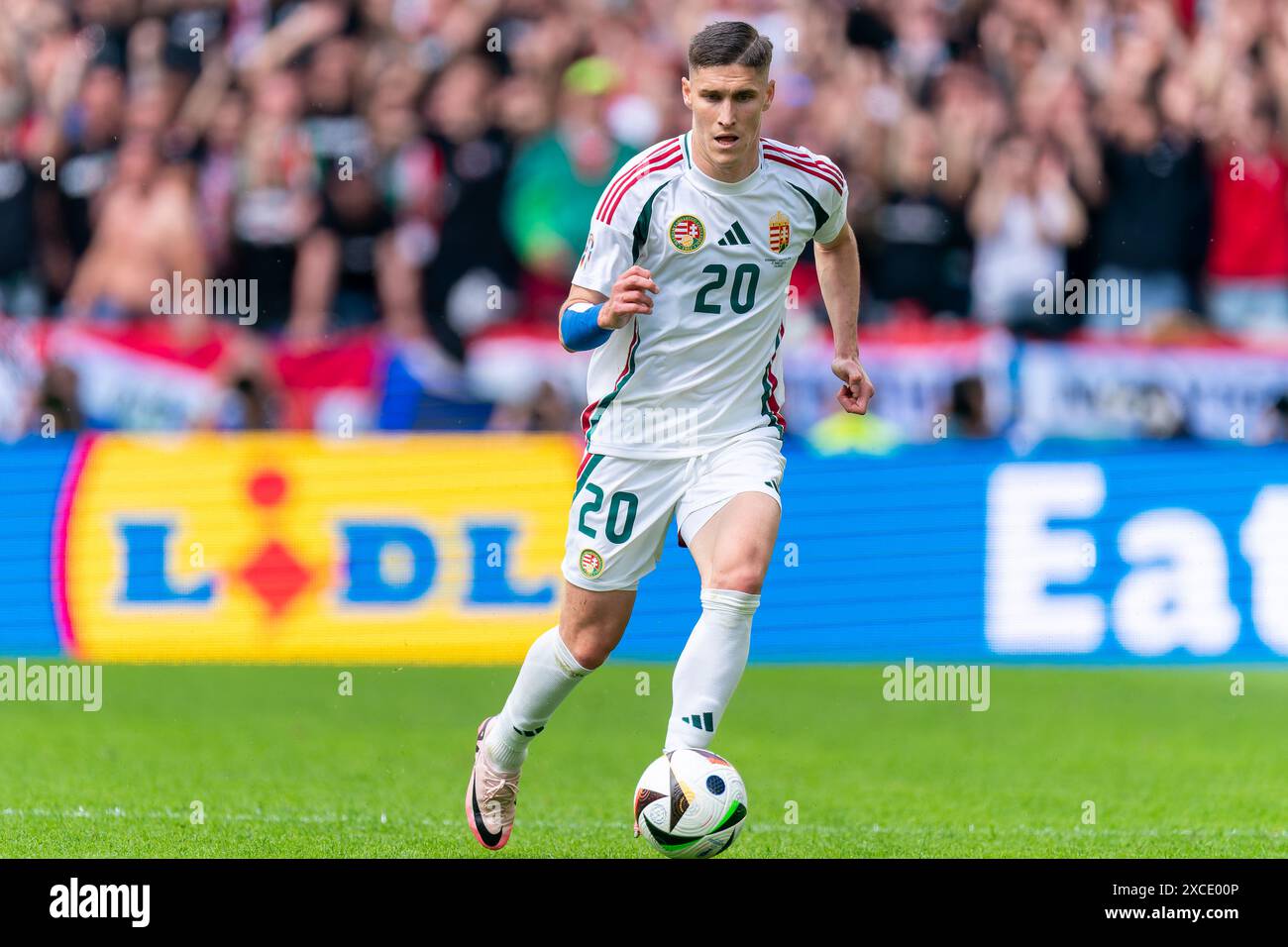 COLOGNE, GERMANY - JUNE 15: Roland Sallai of Hungary runs with the ball ...