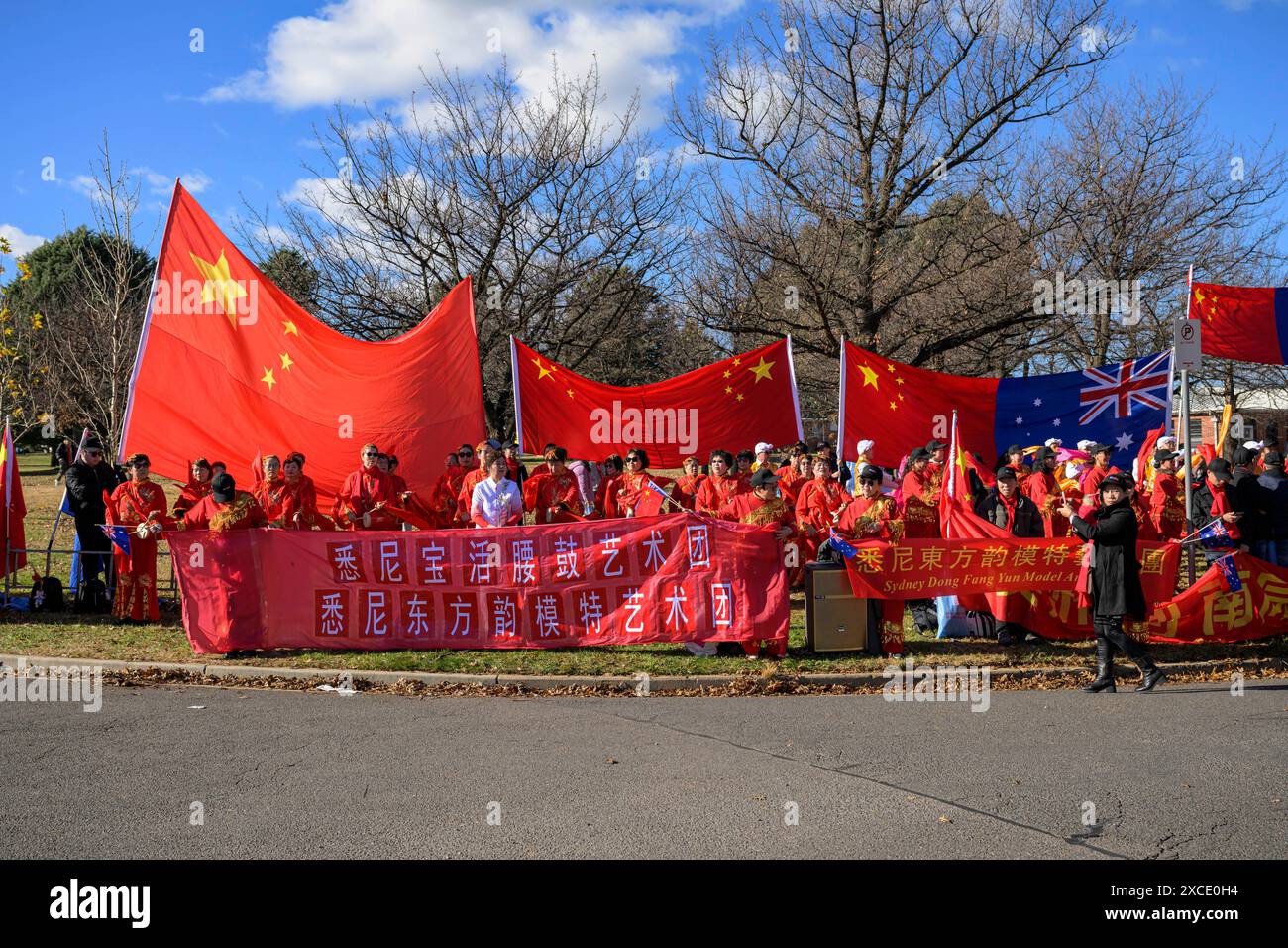 Chinese patriots holding Chinese and Australian national flags, wait ...
