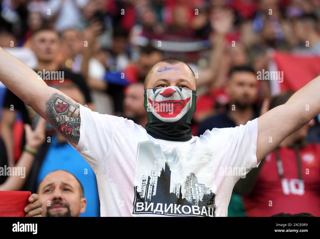 A Serbia fan in a mask in the stands during the UEFA Euro 2024 Group C ...