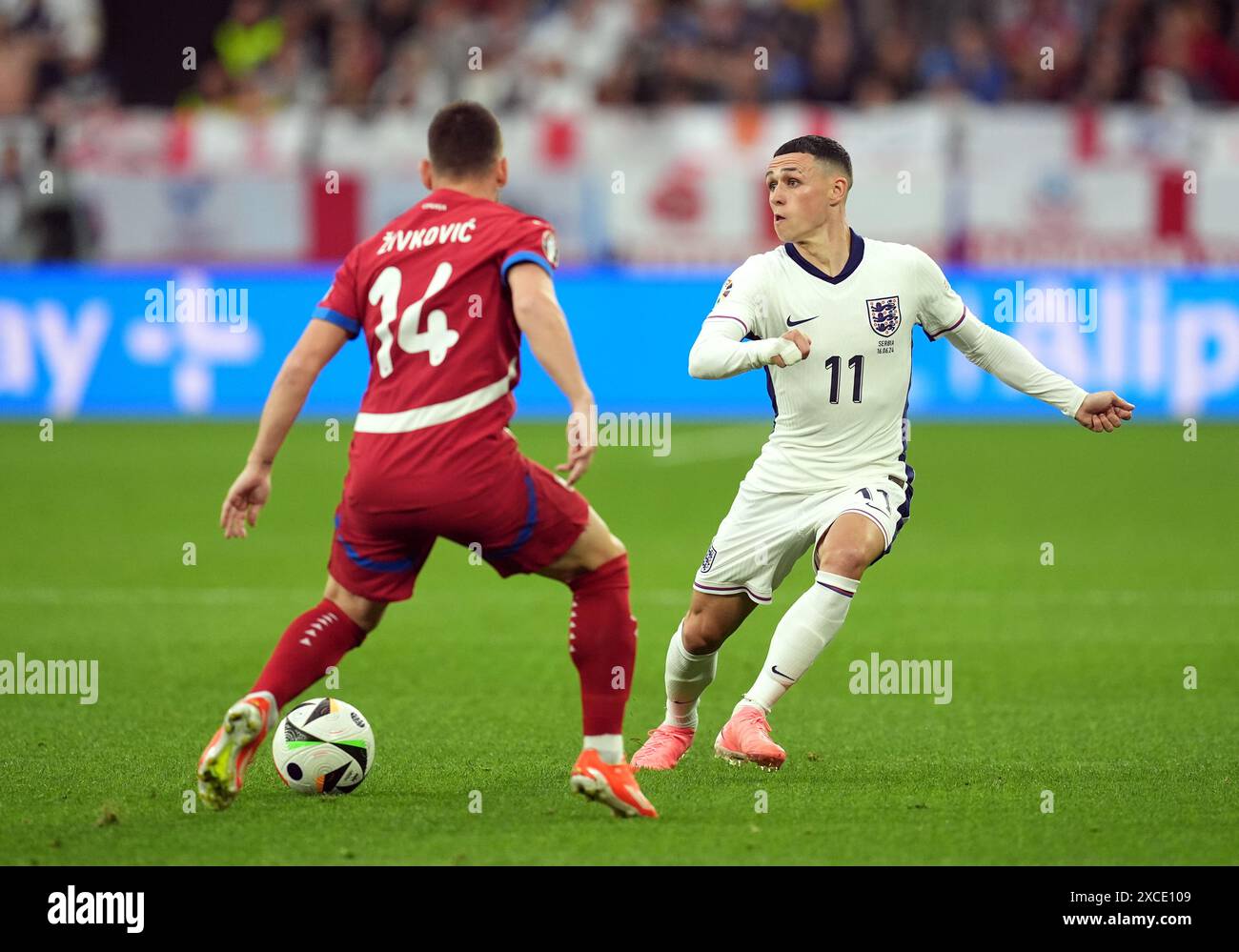 Serbia's Andrija Zivkovic (left) and England's Phil Foden battle for ...