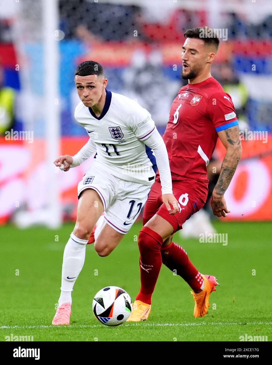 England's Phil Foden (left) and Serbia's Nemanja Gudelj battle for the ...
