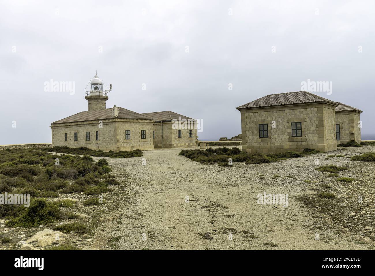 Historic Punta Nati Lighthouse complex in Menorca featuring stone ...