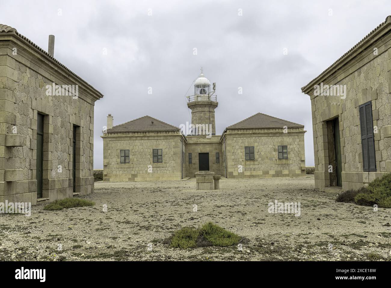 Historic Punta Nati Lighthouse complex in Menorca featuring stone ...