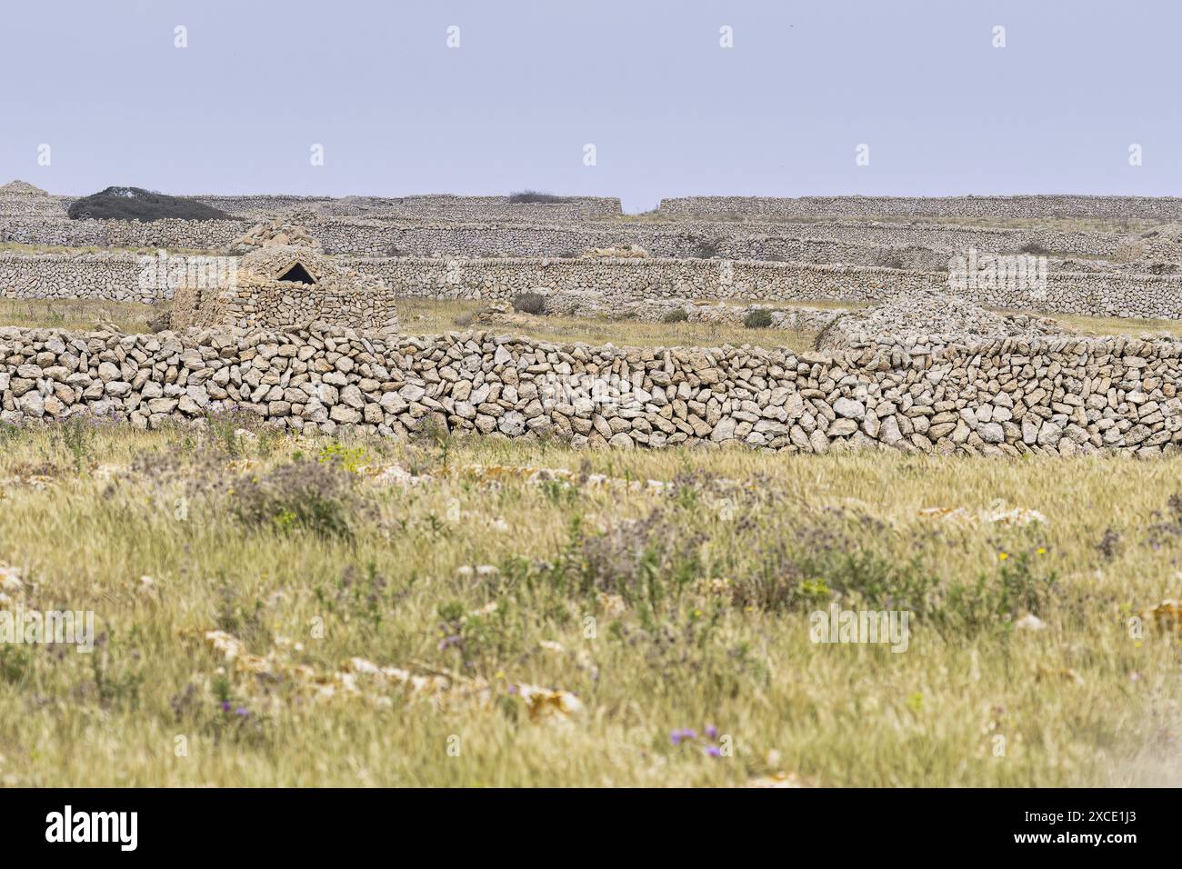 Traditional dry stone constructions at Punta Nati, Menorca. The ...