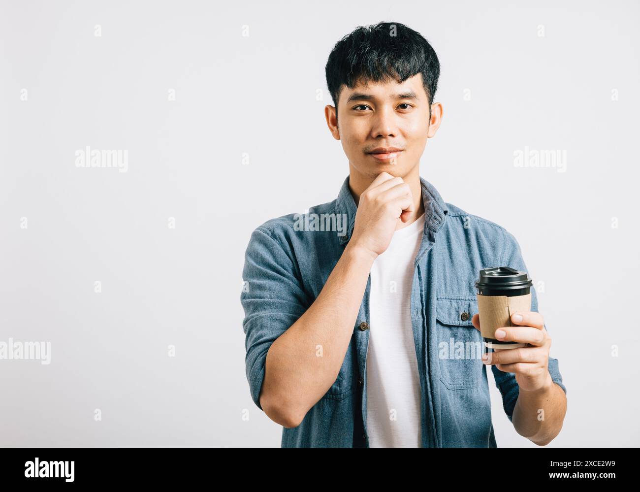 Smiling Thai man with take-away coffee cup in hand Stock Photo - Alamy