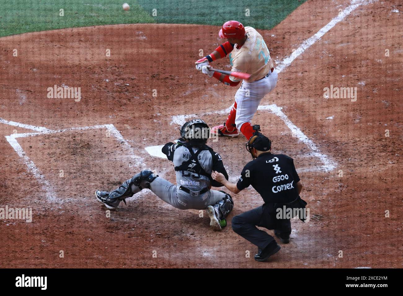 Robinson Cano #22 of Diablos Rojos hits the ball during the match 2 ...