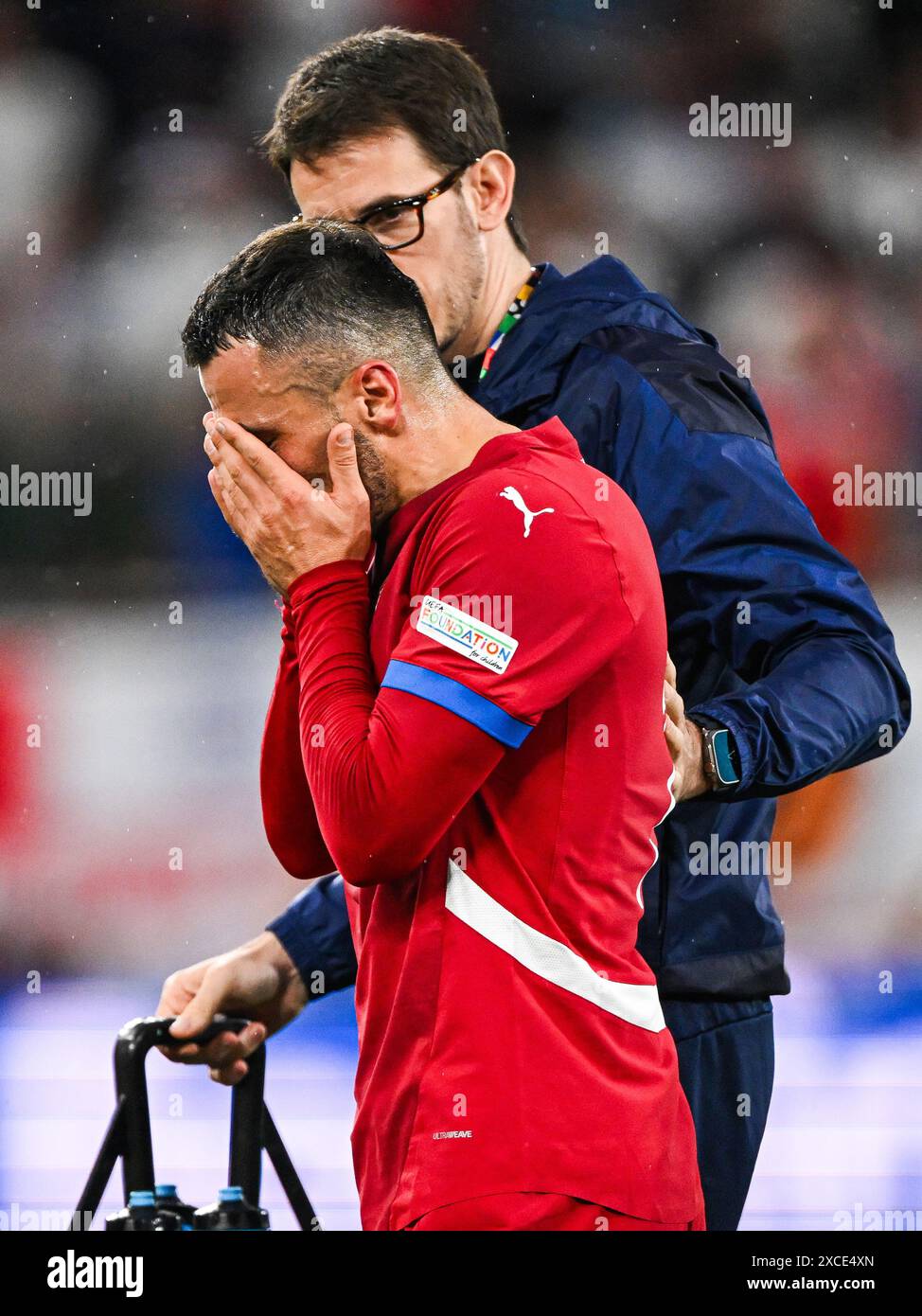 GELSENKIRCHEN - Filip Kostic of Serbia leaves the field with an injury ...
