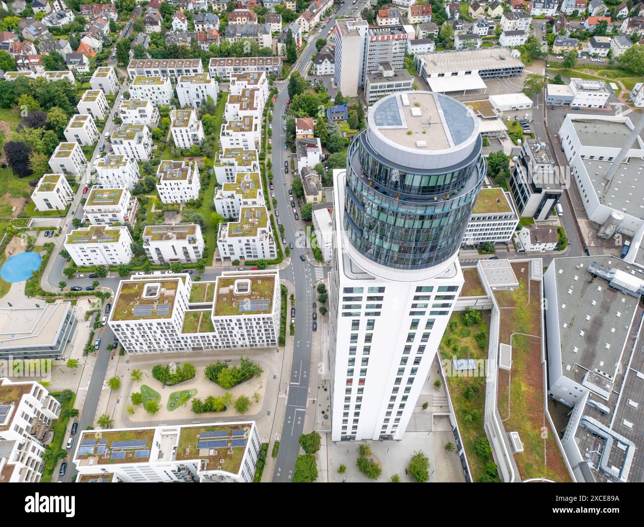 Aerial view of Neuer Henninger-Turm surrounded by modern residential ...
