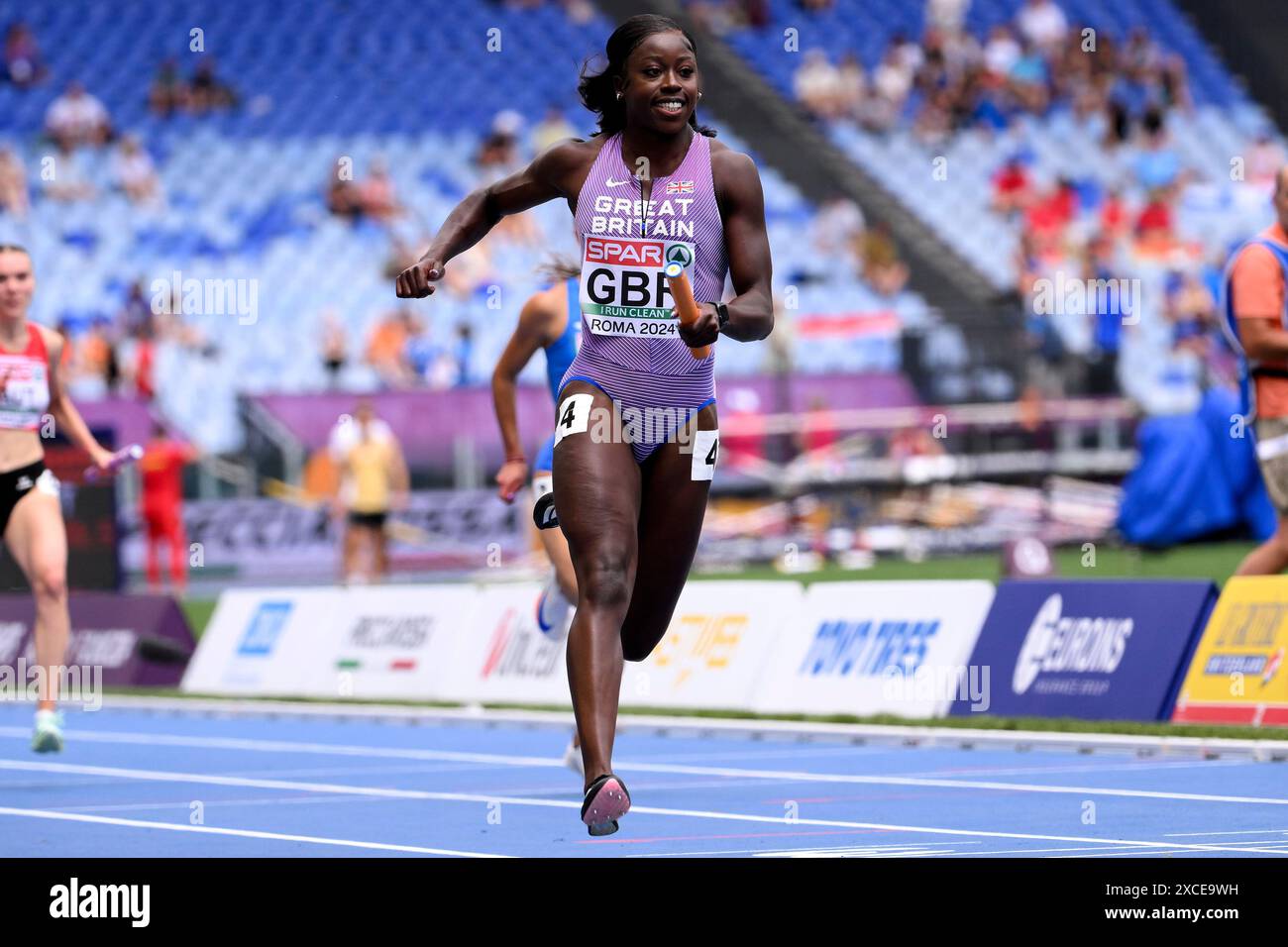 Desiree Henry of Great Britain competes in the 4x100m relay women heat ...