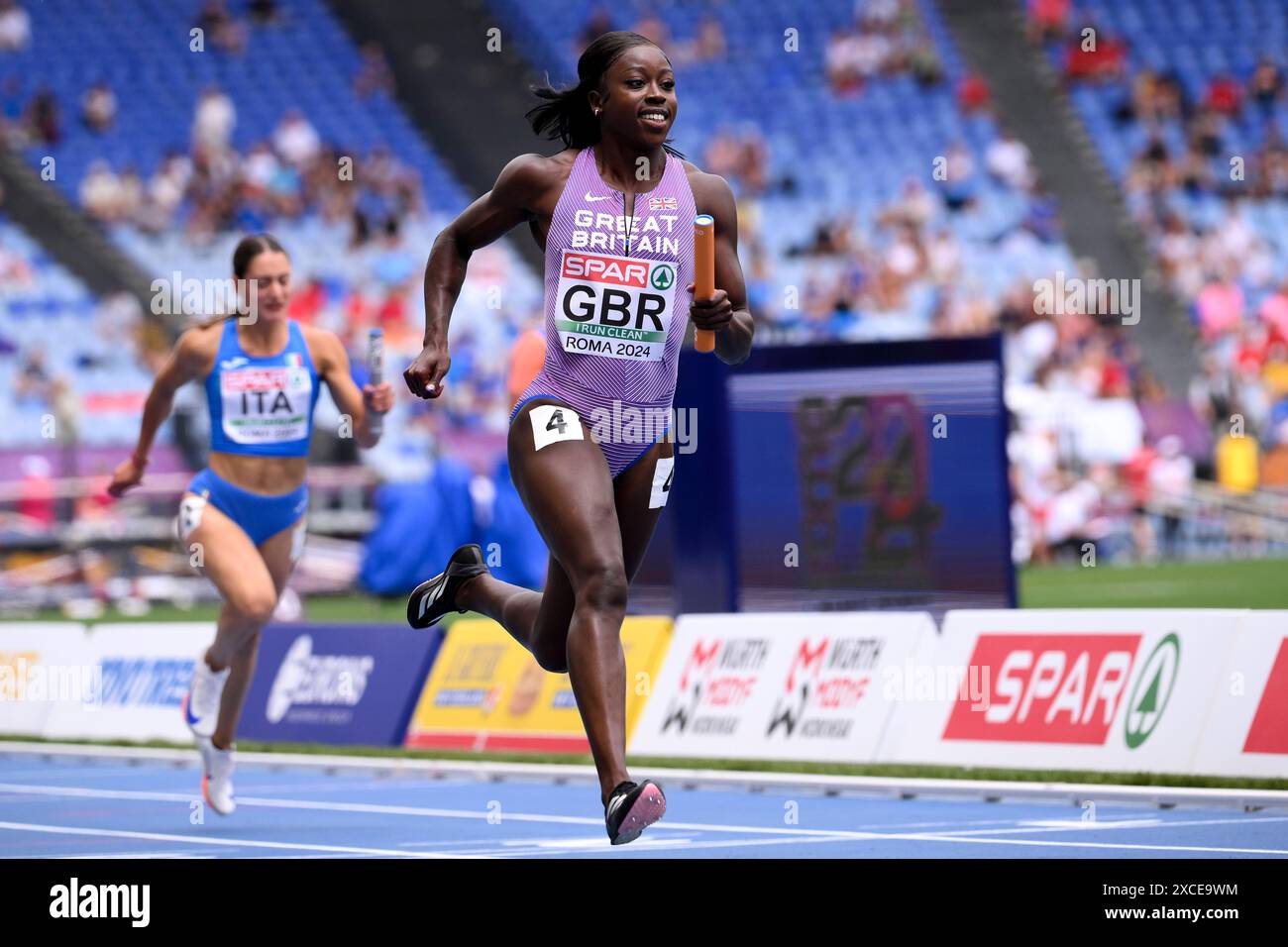 Desiree Henry of Great Britain competes in the 4x100m relay women heat ...