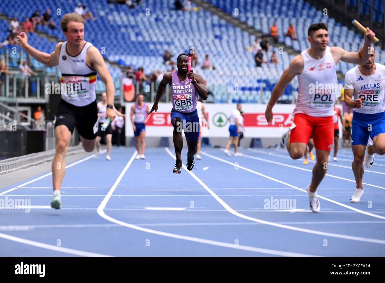Romell Glave of Great Britain (c) competes in the 4x100m relay men heat ...