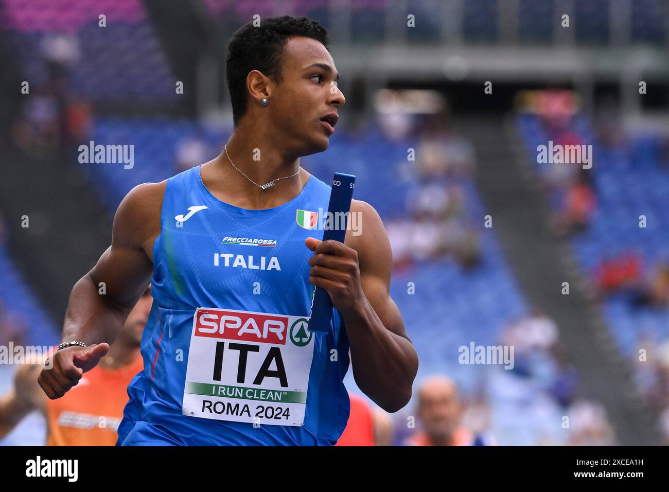 Lorenzo Ndele Simonelli of Italy competes in the 4x100m relay men heat ...