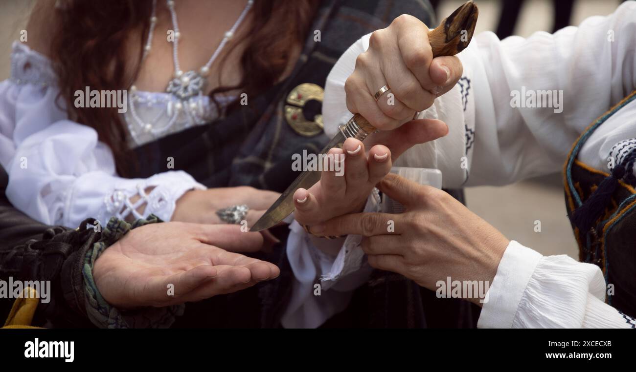 Cutting the palm with a knife Stock Photo - Alamy