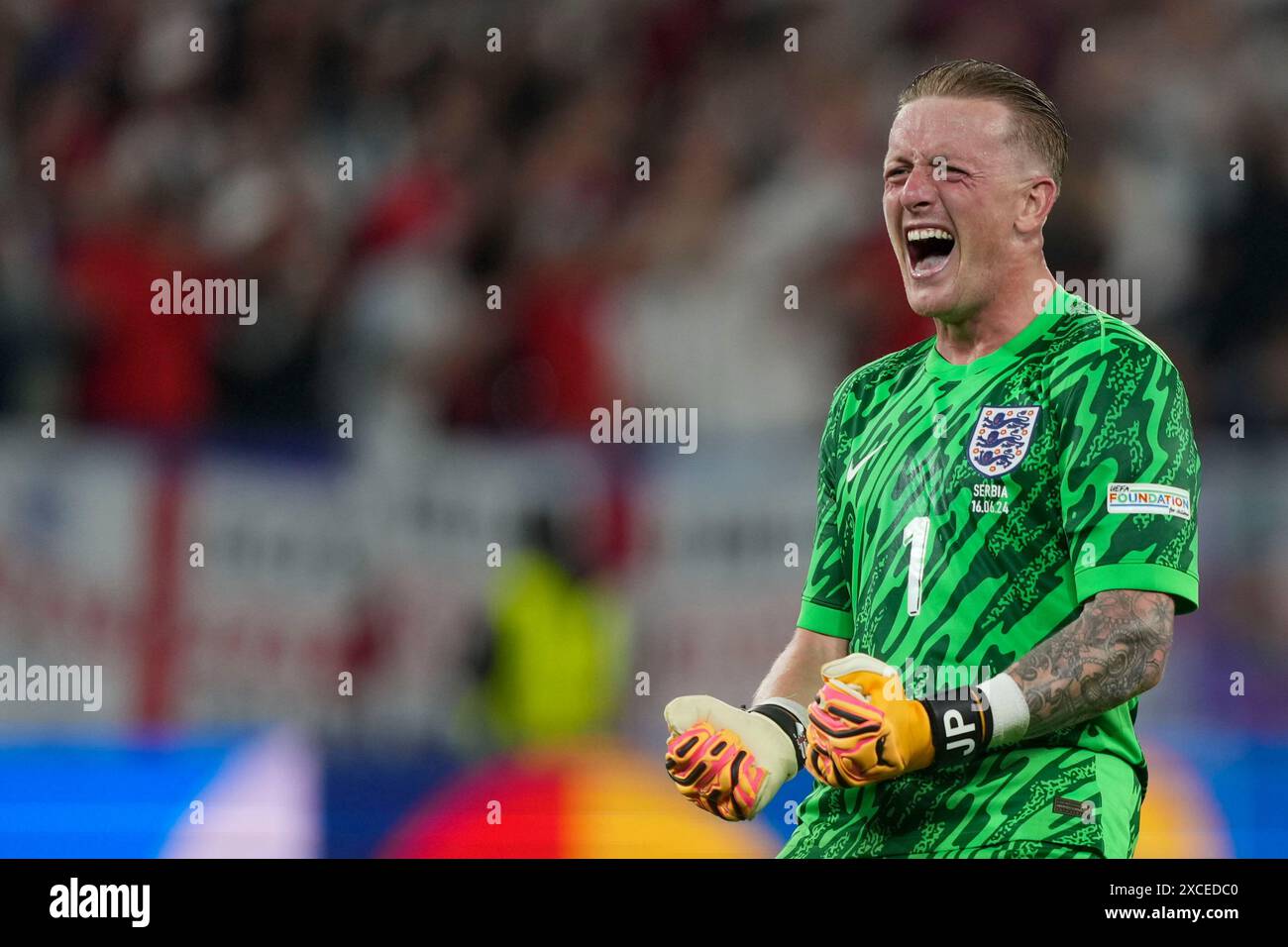 England's goalkeeper Jordan Pickford celebrates at the end of a Group C ...
