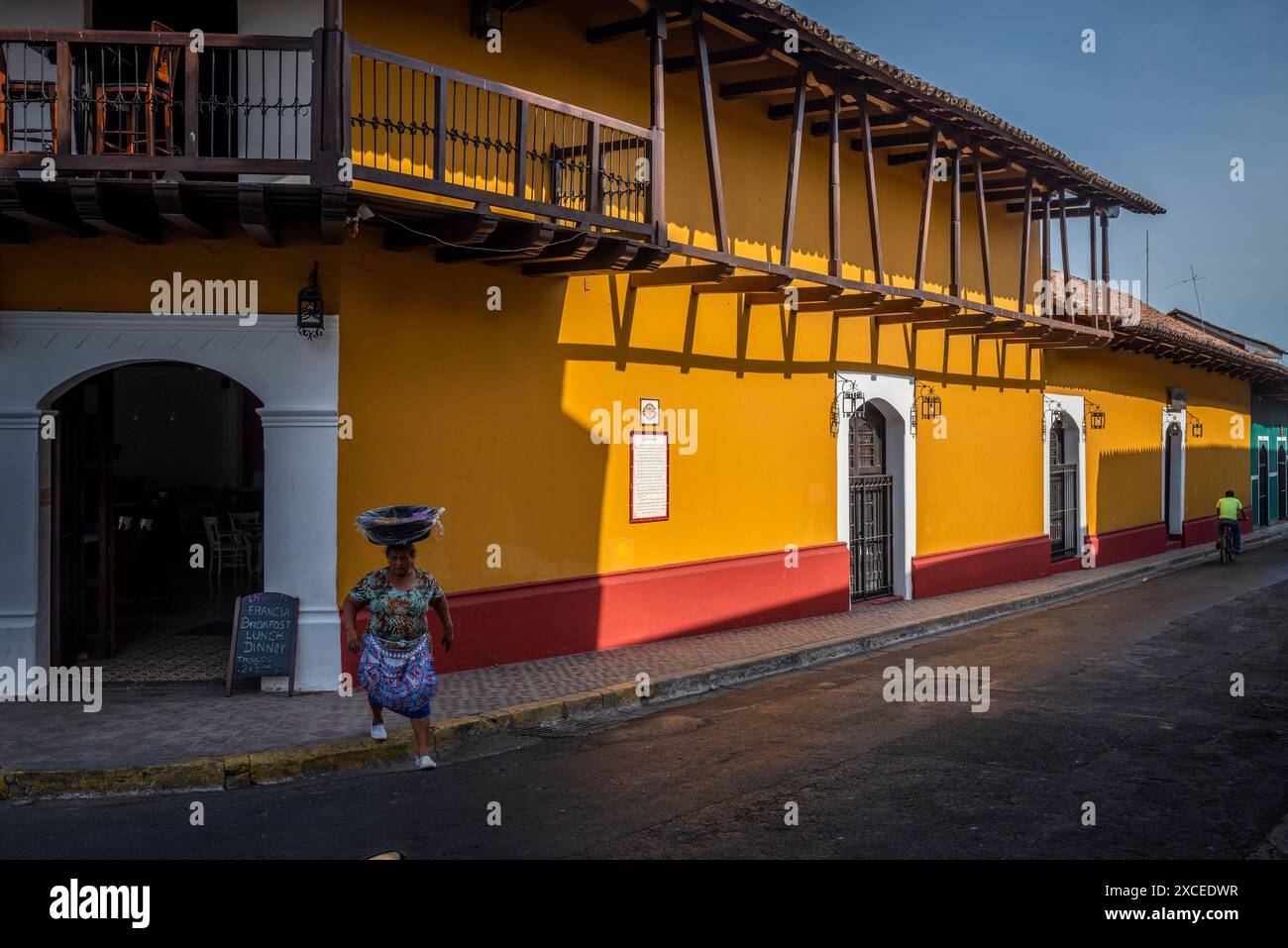 Typical colonial style street in the city centre with colourful houses ...