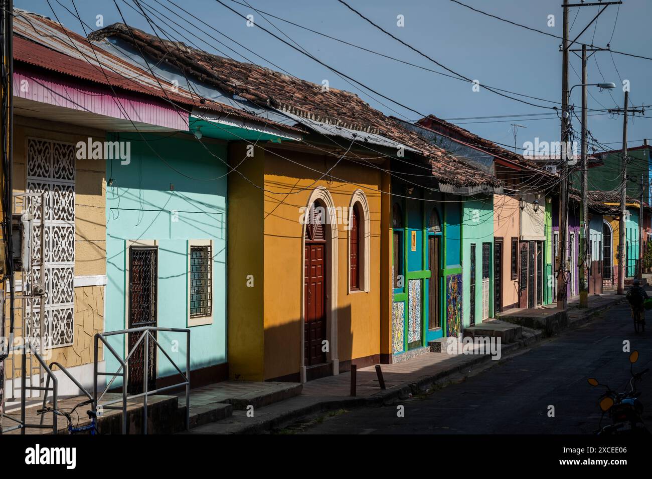 Typical colonial style street in the city centre with colourful houses ...