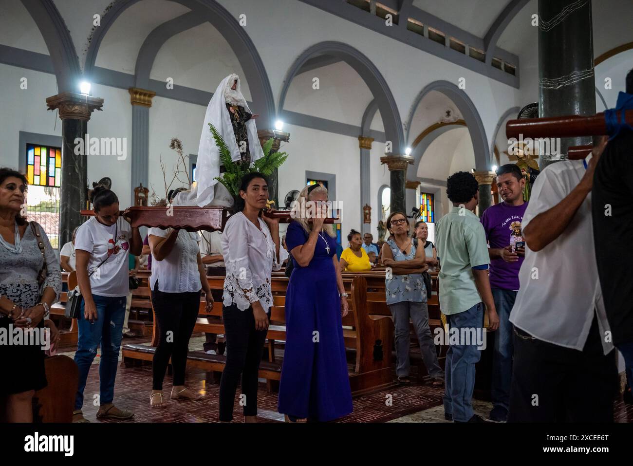 Lent procession of women carrying the statue of Virgin Mary, Guadalupe ...