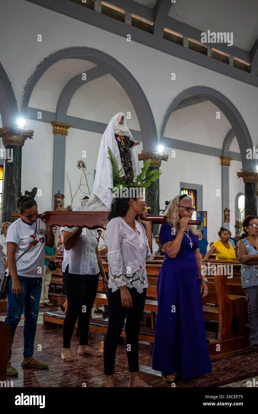 Lent procession of women carrying the statue of Virgin Mary, Guadalupe ...
