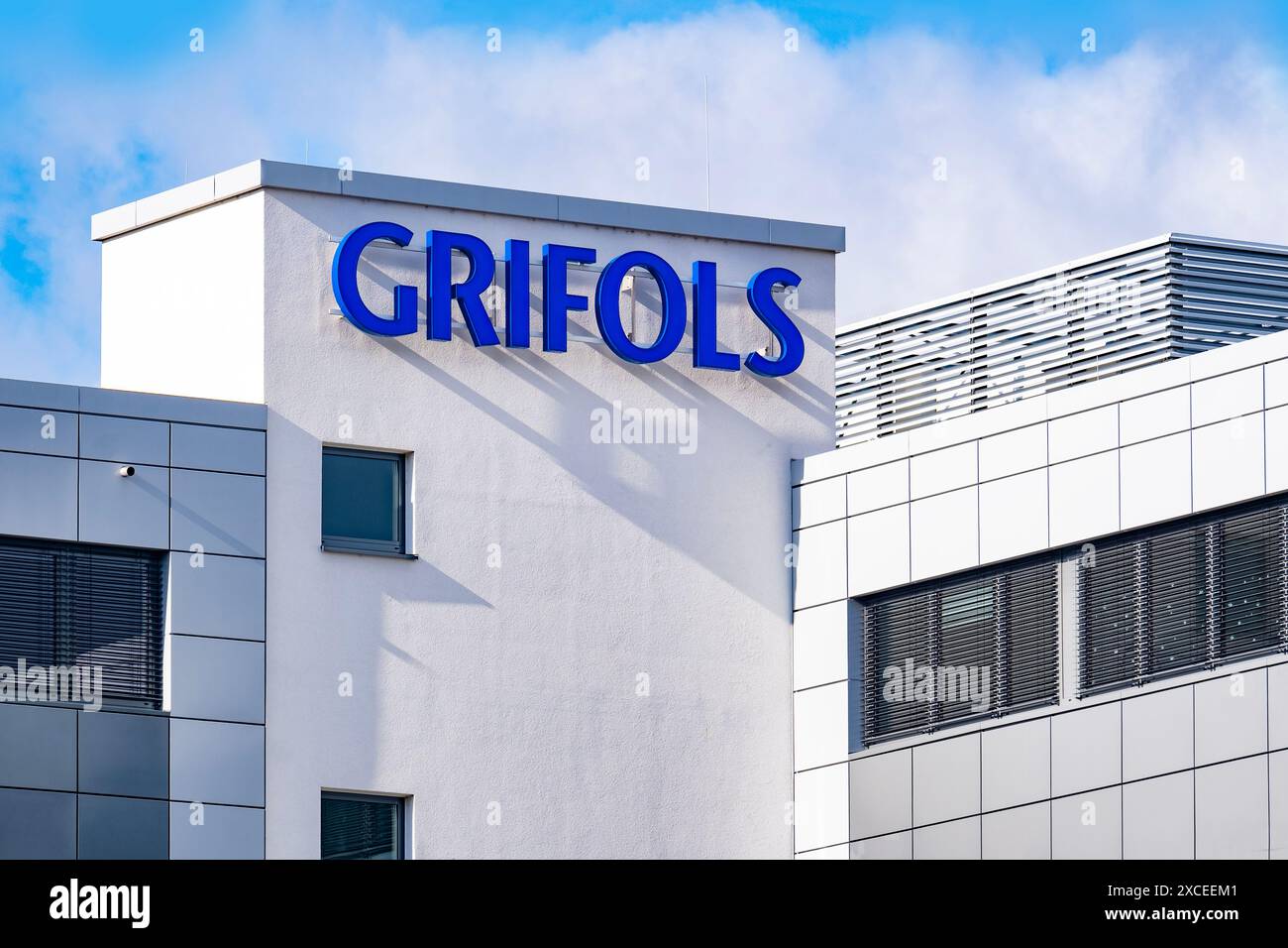building with letters GRIFOLS in blue, global healthcare company ...