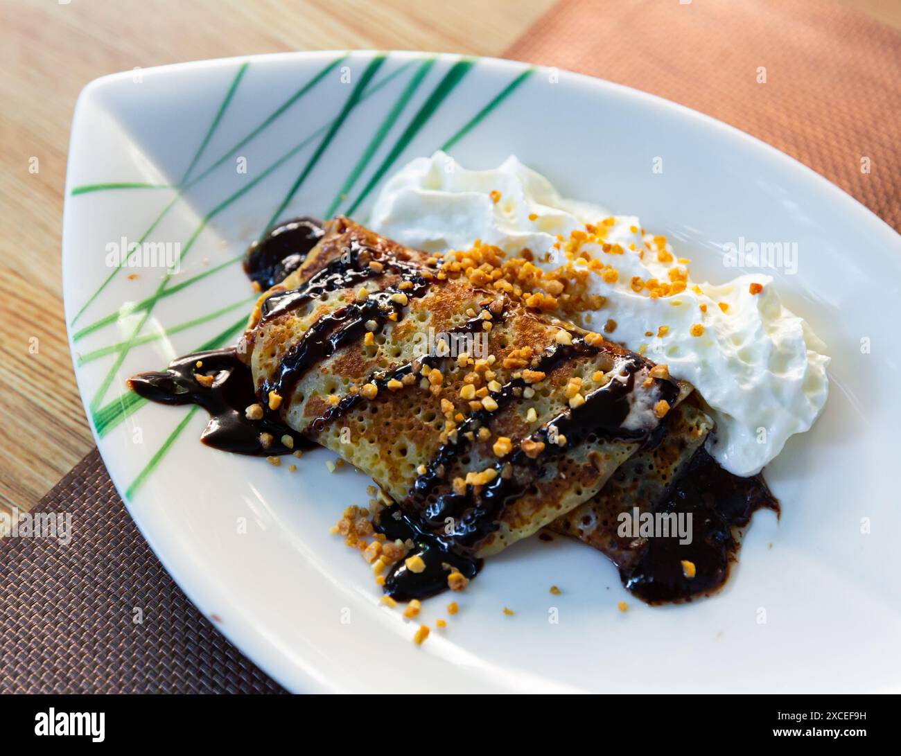 Crepes with cream cheese mousse, nut, chocolate Stock Photo - Alamy