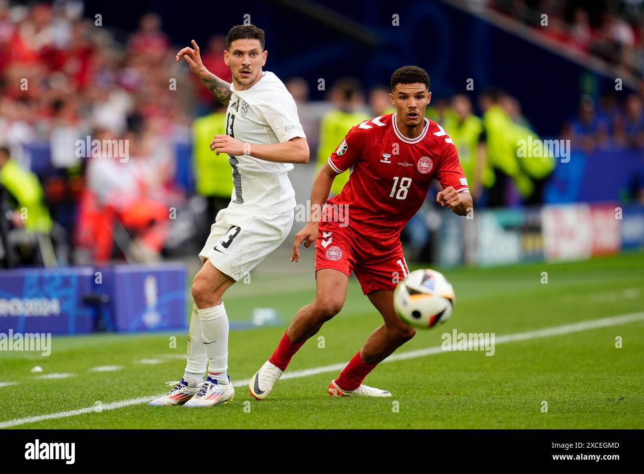 Slovenia's Erik Janza (left) and Denmark's Alexander Bah battle for the ...