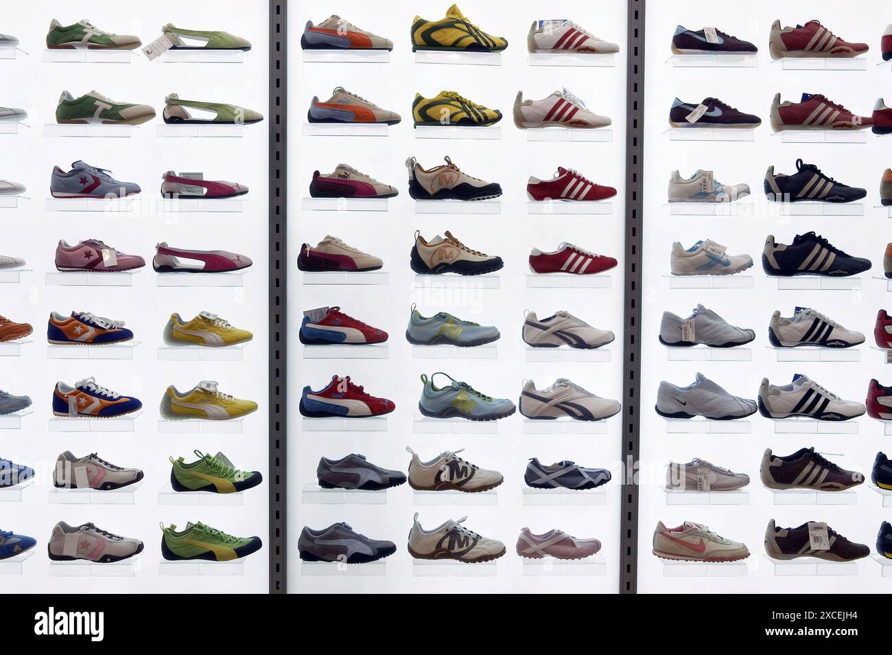 Sports shoes in shoe shop, shopping mall Stock Photo - Alamy