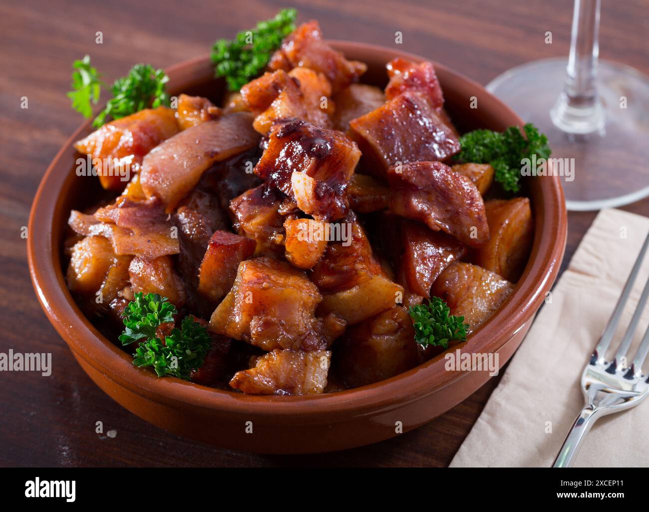 Morro de cerdo - spanish dish. Roast nose and cheek pigs with parsley ...