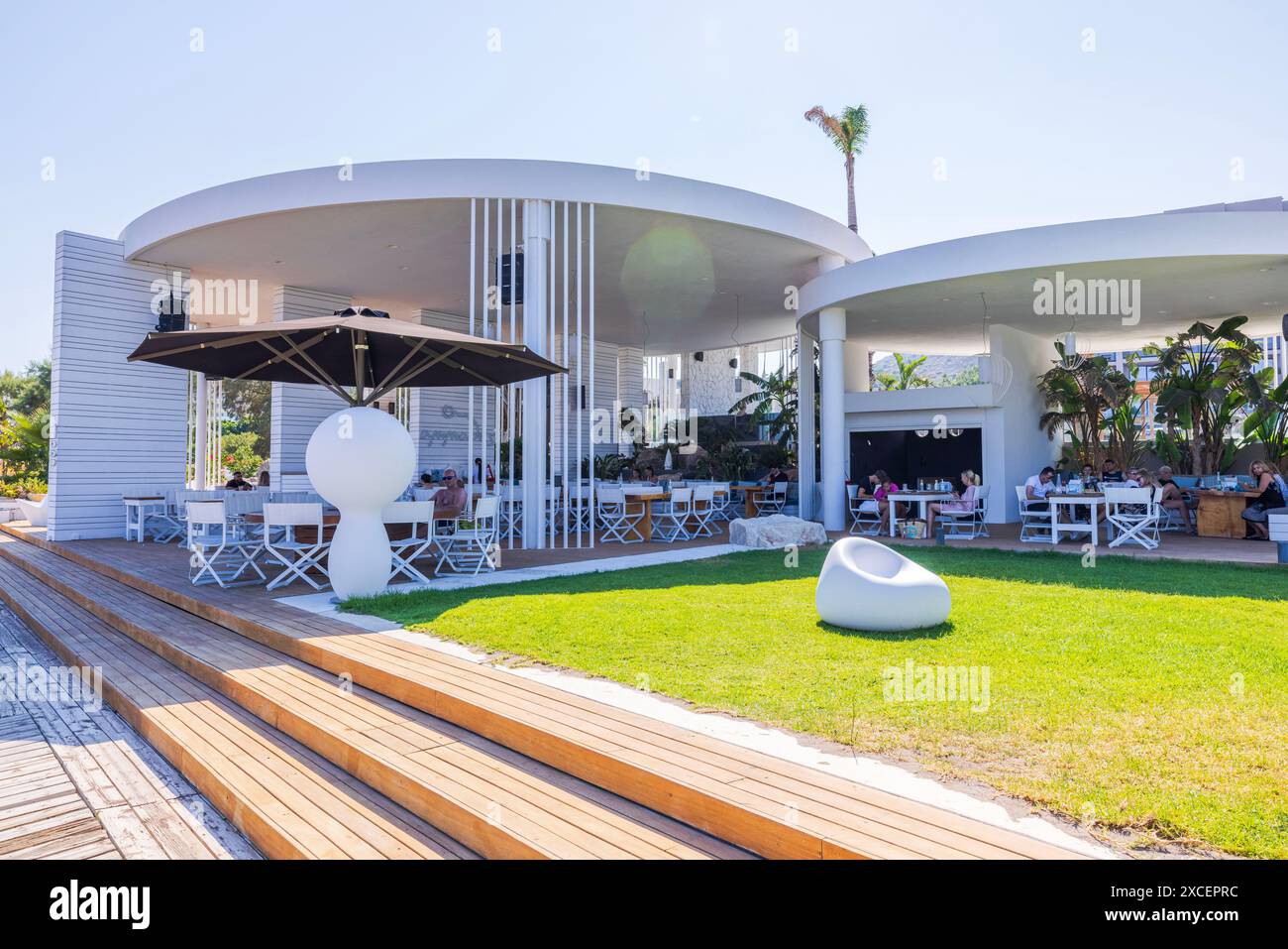 Beautiful view of a modern outdoor café with round white buildings ...