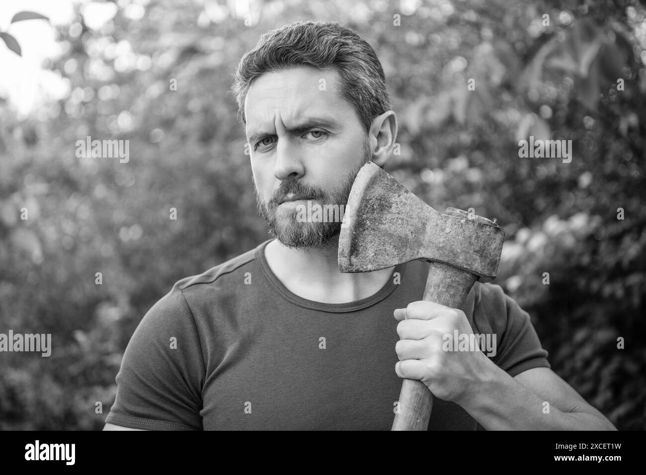 masculine guy man with axe. bearded masculine guy with axe. masculine guy with axe outdoor Stock ...