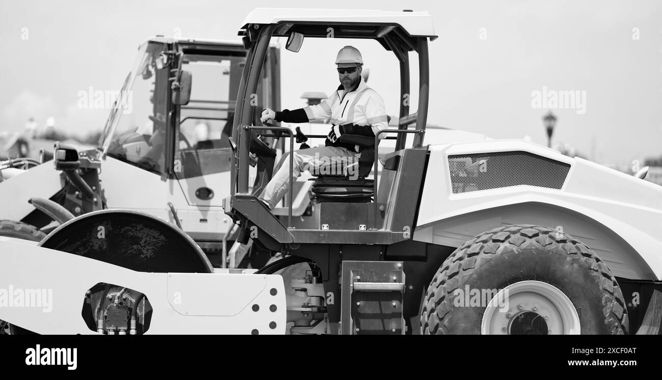 Man compactor Black and White Stock Photos & Images - Alamy