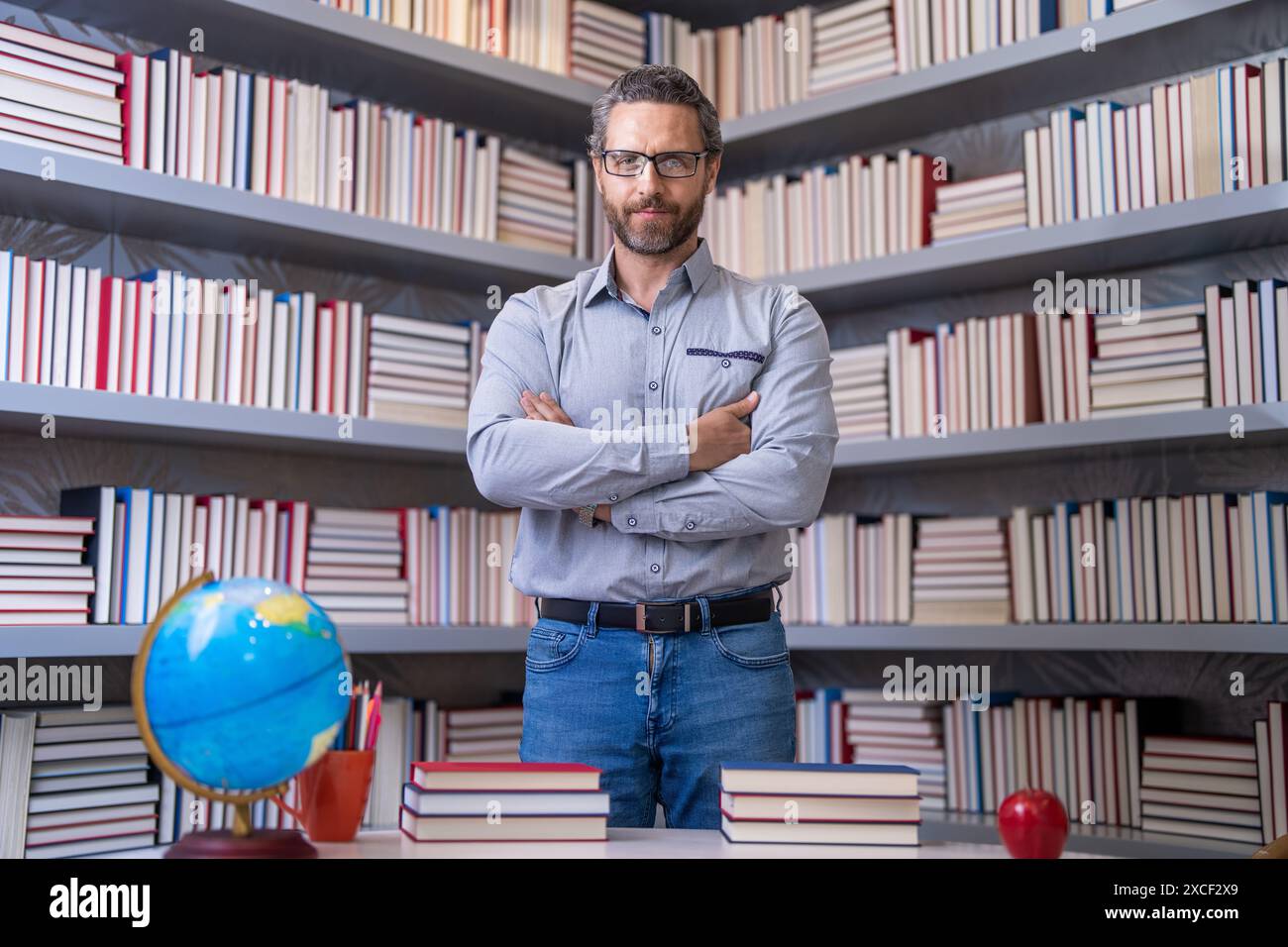 man tutor at school exam. tutor with book at lesson. teaching school ...