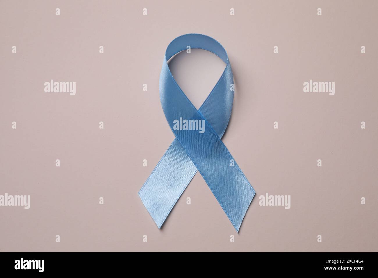 International Psoriasis Day. Light blue ribbon as symbol of support on ...