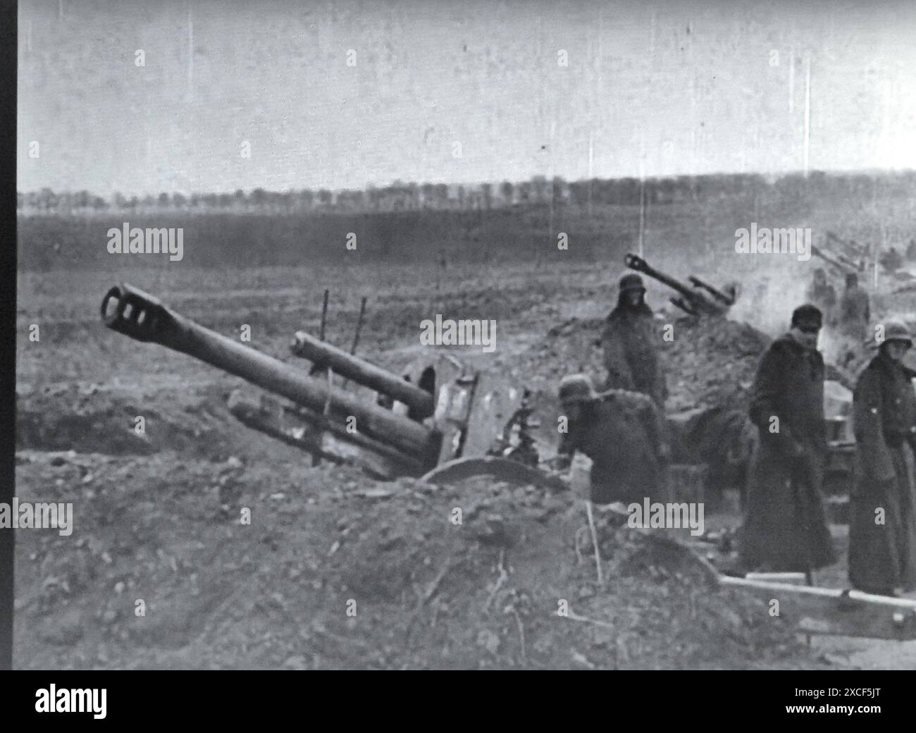 World War Two B&W Screenshot photo . German Artillery fires over the ...