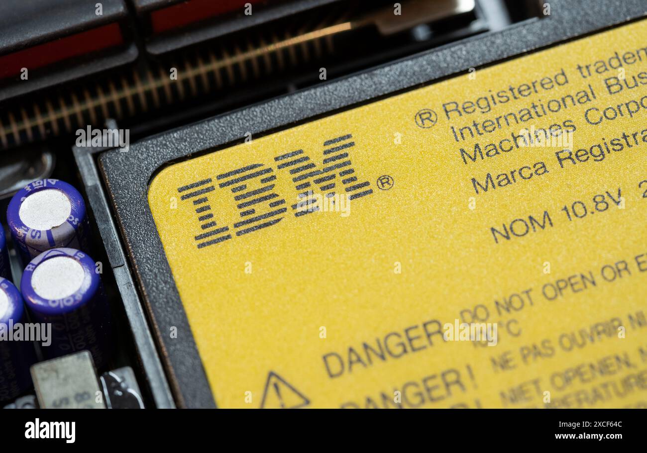 Old IBM company logo on a laptop battery cell, electronic device ...