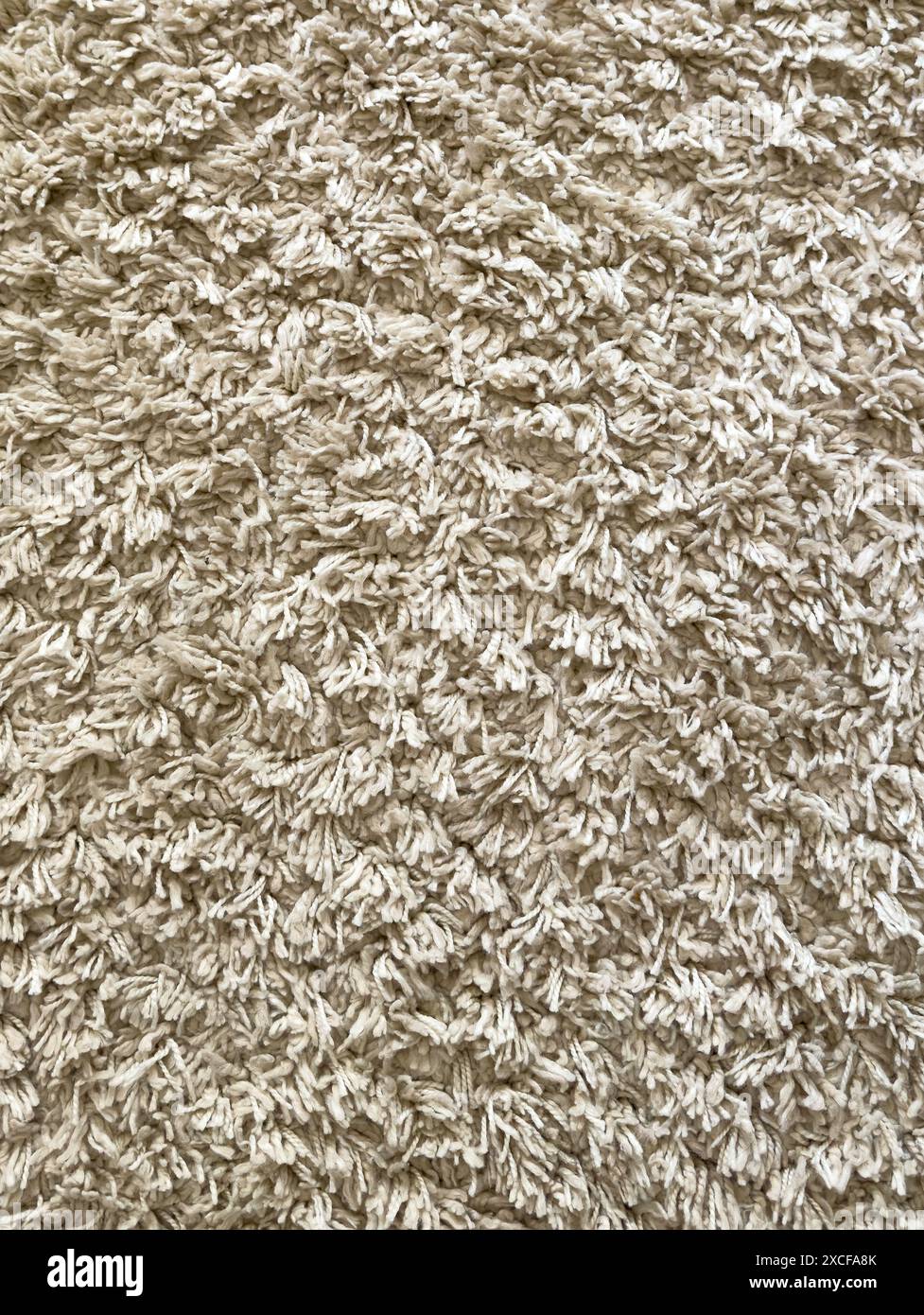 Beige coloured shag pile floor rug texture Stock Photo - Alamy