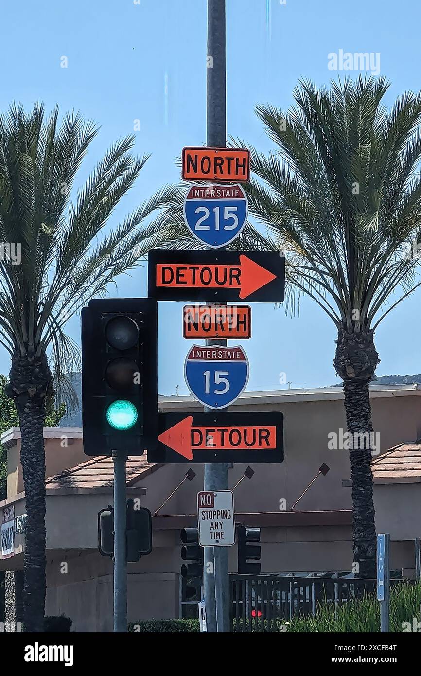 Multiple orange detour and road signs make for confusing directions ...