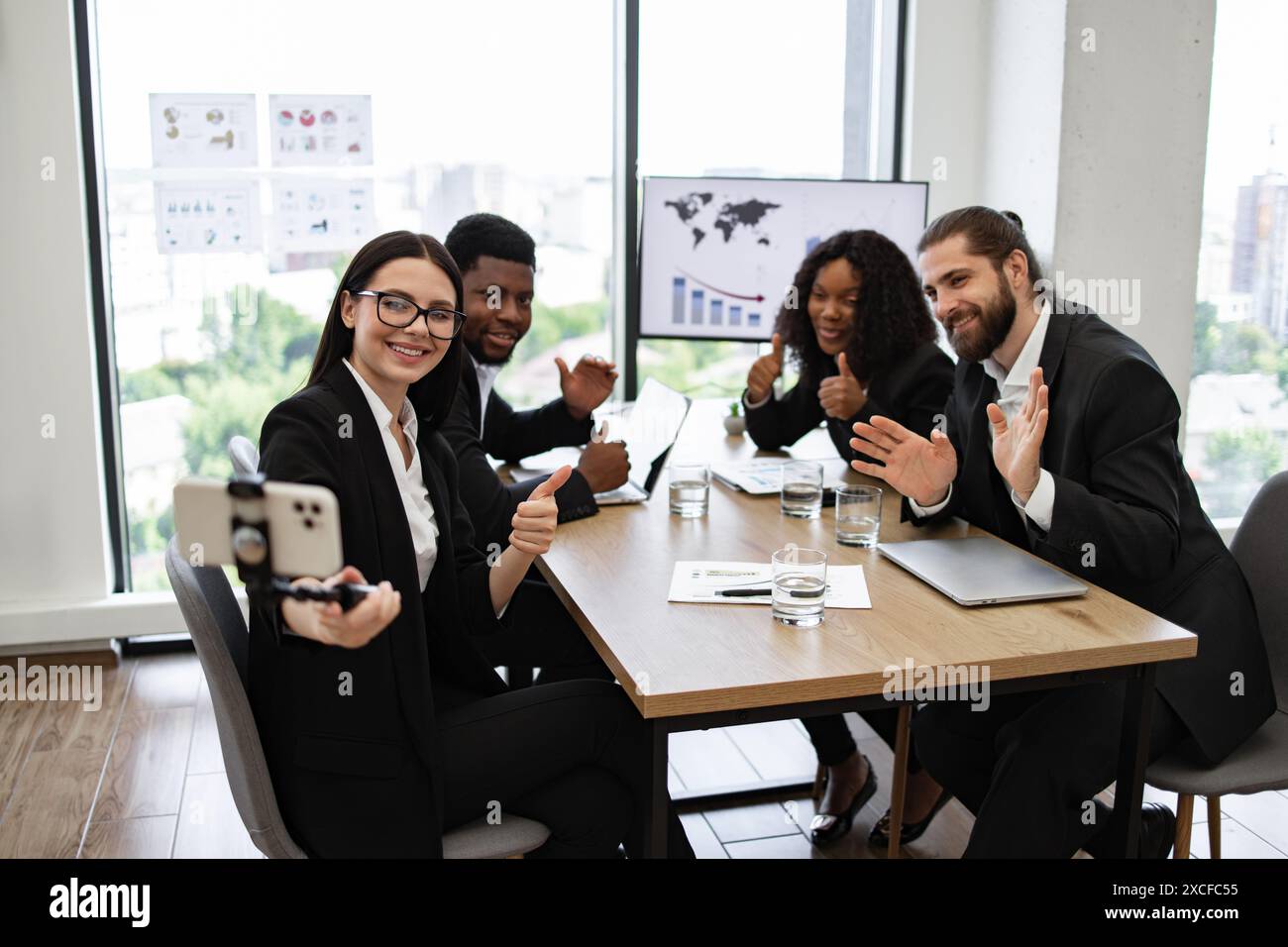 Team meeting with business professionals taking a group selfie Stock ...