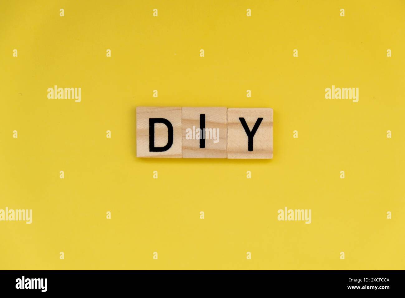DIY text on bright yellow background. Concept of creative crafting ...