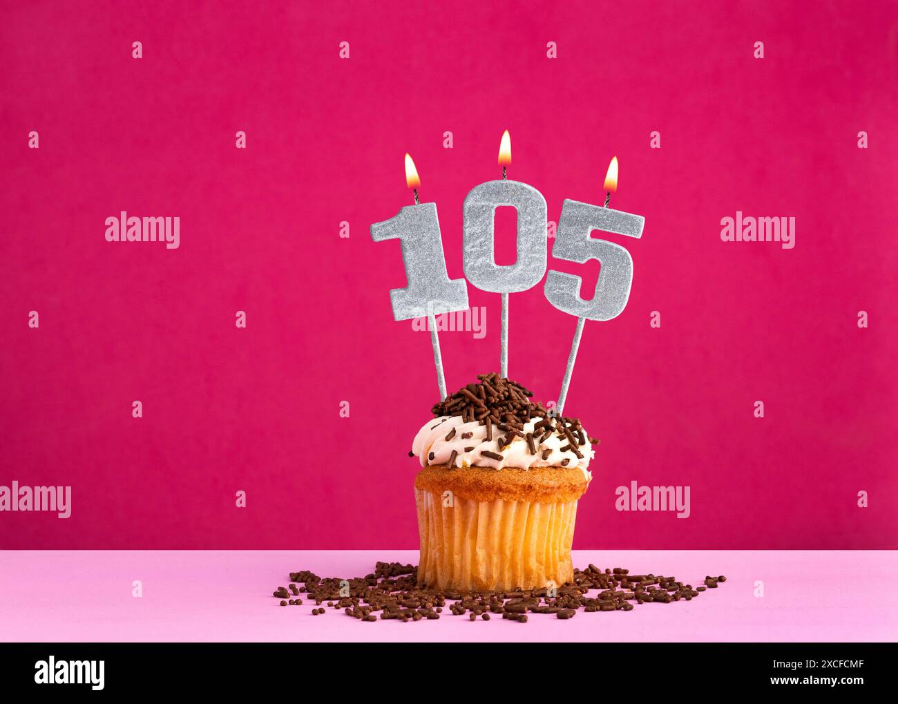 Birthday cupcake with candle number 105 - Birthday card on pink ...