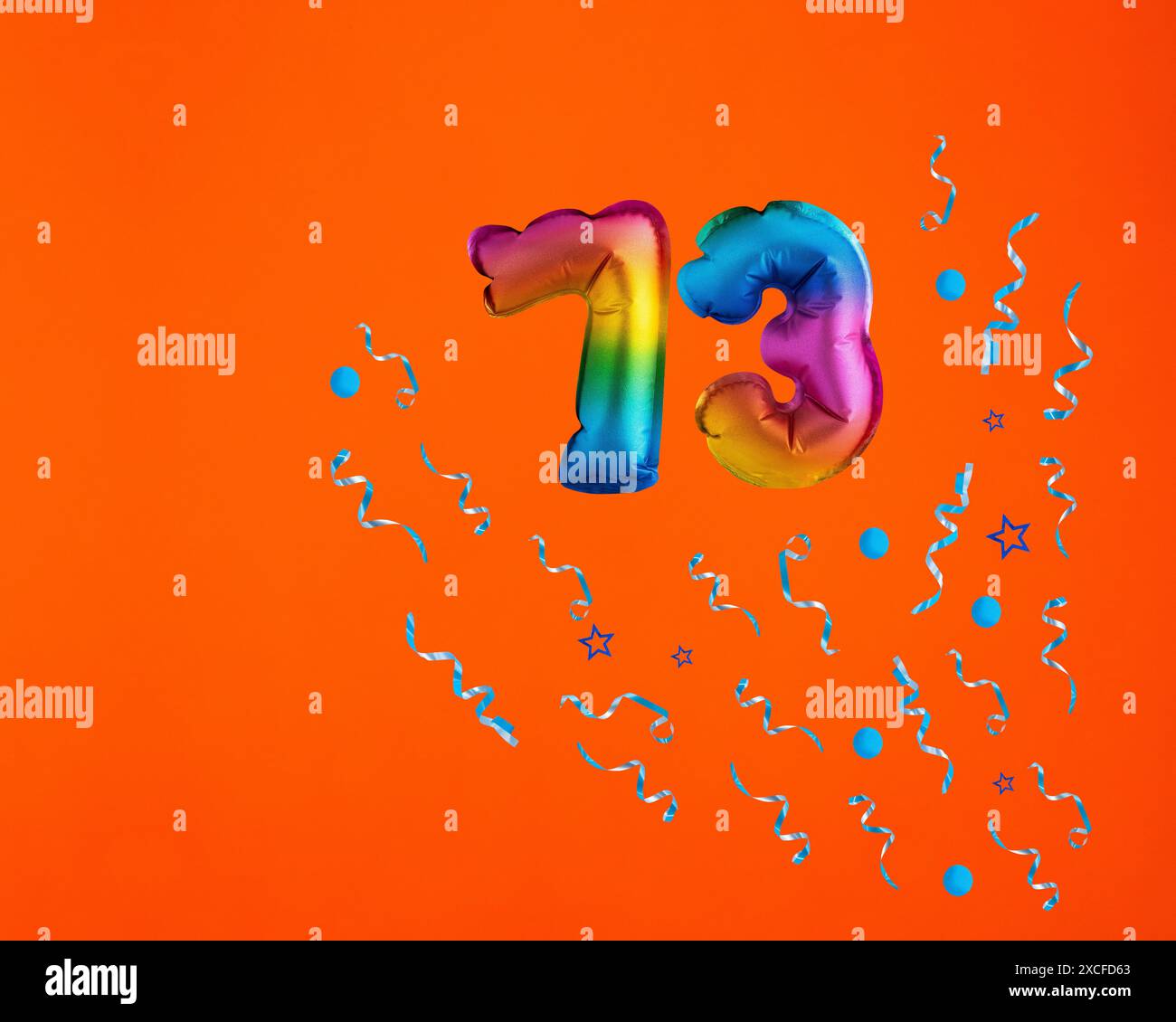 Confetti explosion with number 73 balloon - Celebration on orange ...