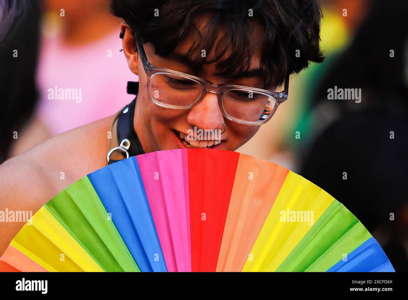 A young protester holds a rainbow fan during a demonstration for LGTBQ ...