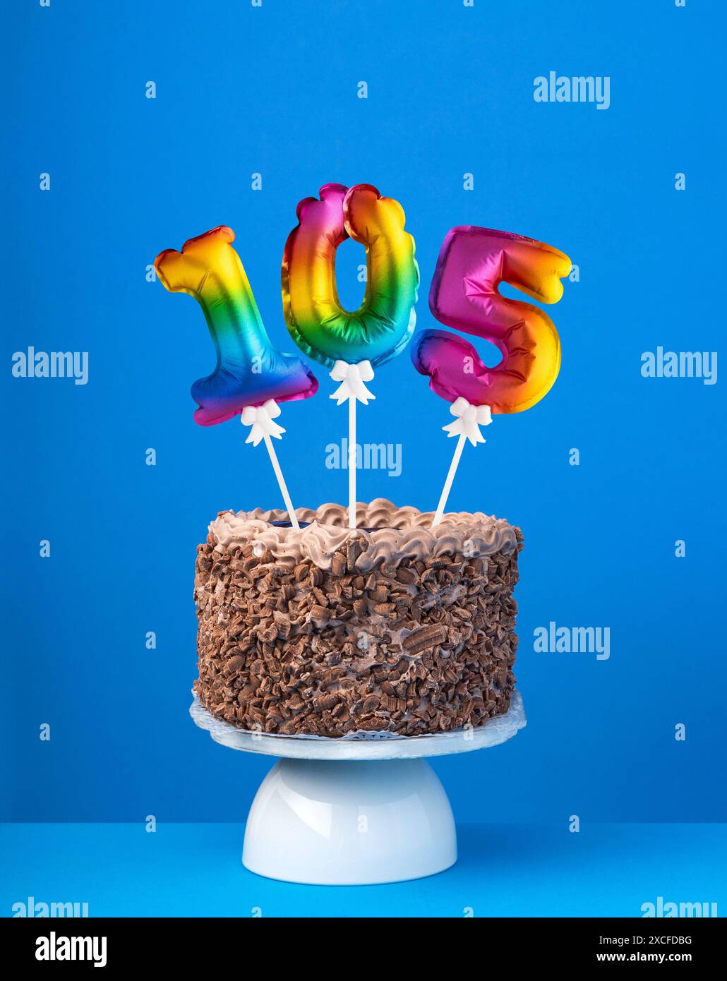 Air balloon number 105 - Birthday cake on blue background Stock Photo ...