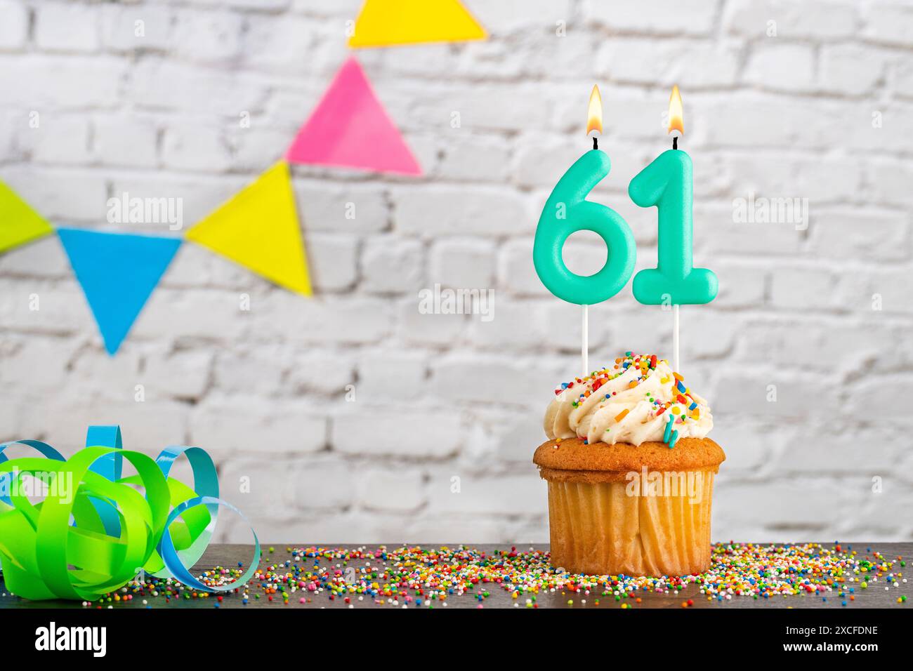 Candle number 61 - Birthday celebration with cupcake Stock Photo - Alamy