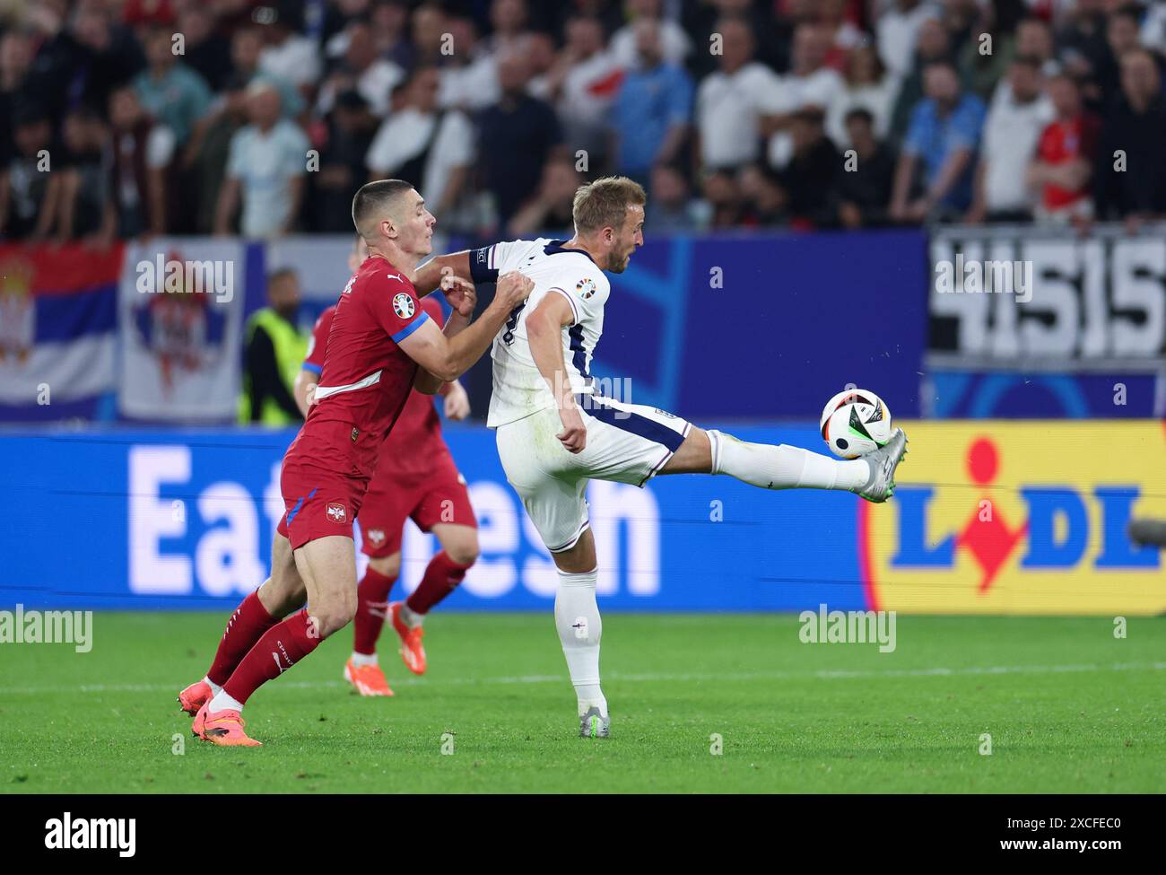 Gelsenkirchen. 16th June, 2024. Harry Kane (R) of England competes ...