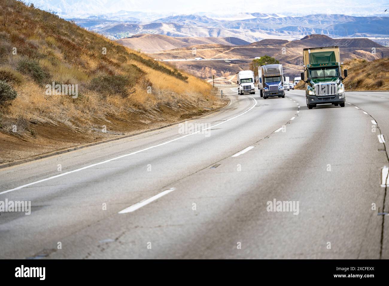 Industrial carriers convoy of the big rig semi-truck tractors ...
