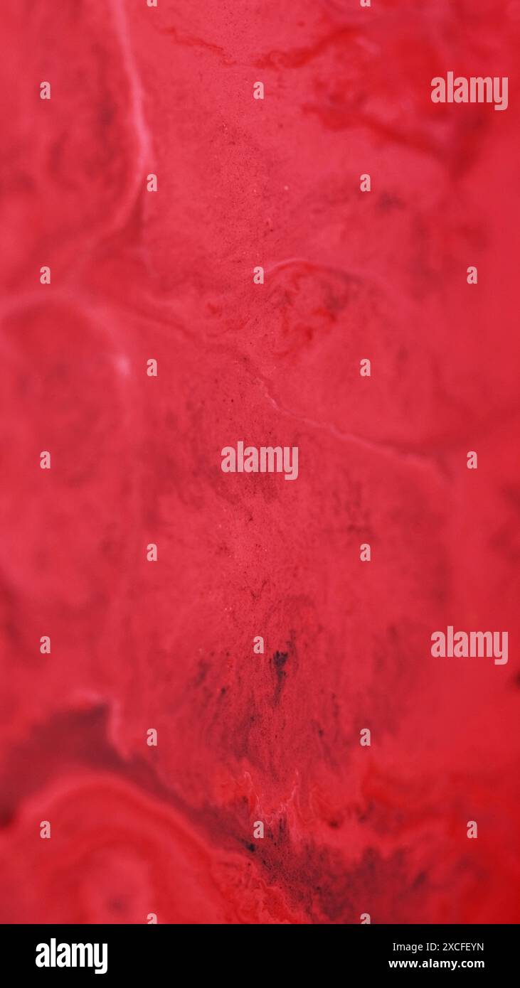 Ink spill. Paint water flow. Defocused red pink white color pigment ...