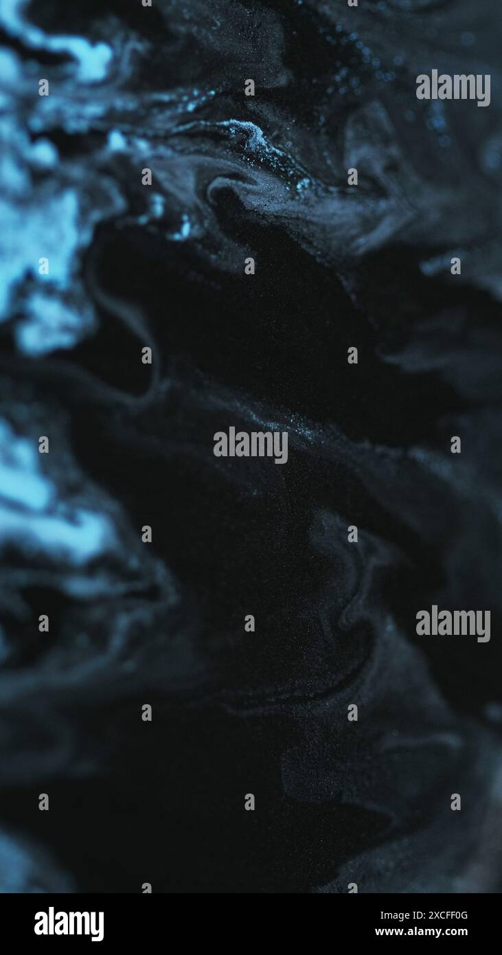 Shiny paint drip. Glitter fluid wave. Defocused black neon blue color ...