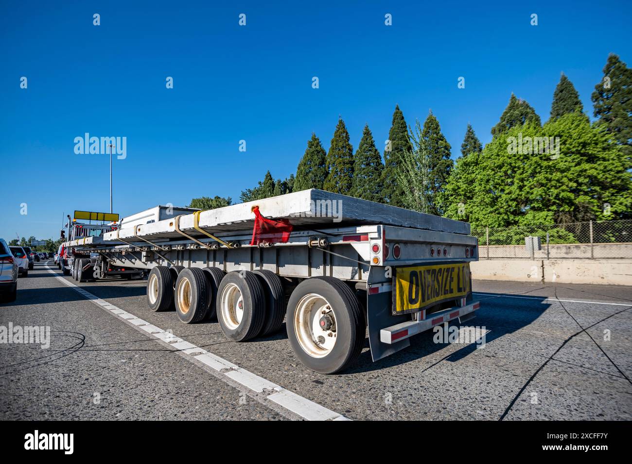 Industrial carrier red day cab big rig semi truck with oversize load ...