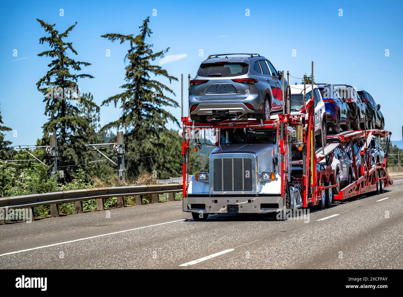 Industrial carrier powered day cab big rig white car hauler semi-truck ...